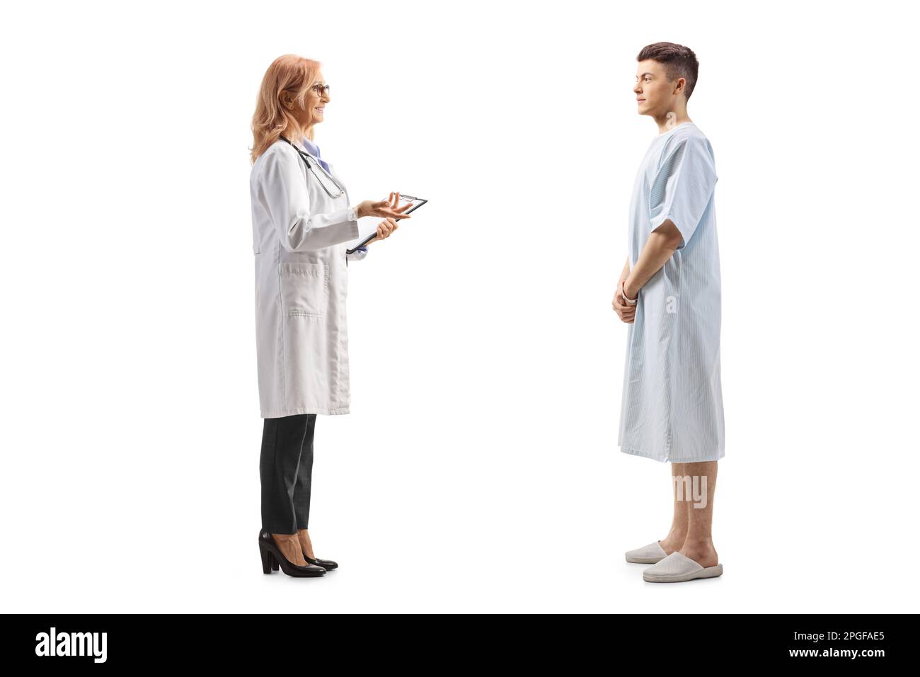 Full length profile shot of a doctor talking to a young hospitalized ...