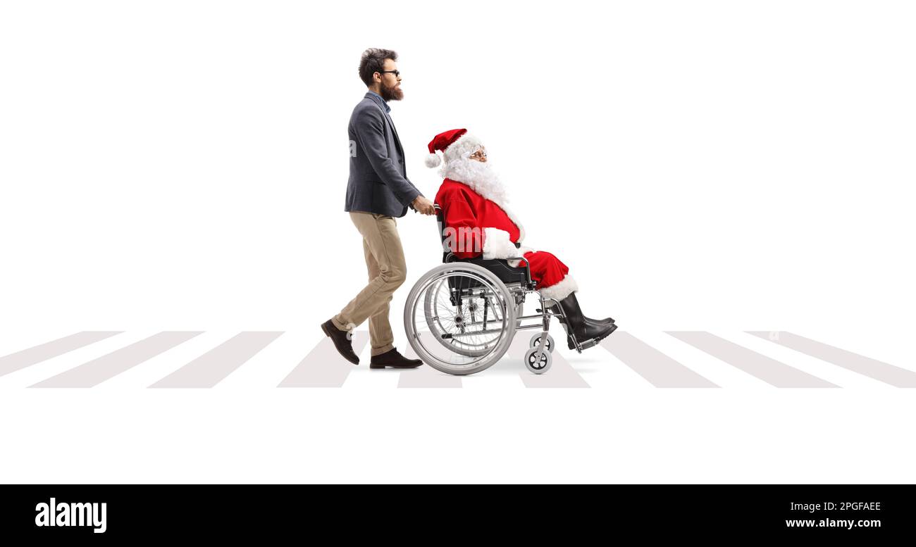 Full length profile shot of a man pushing santa claus in a wheelchair ...