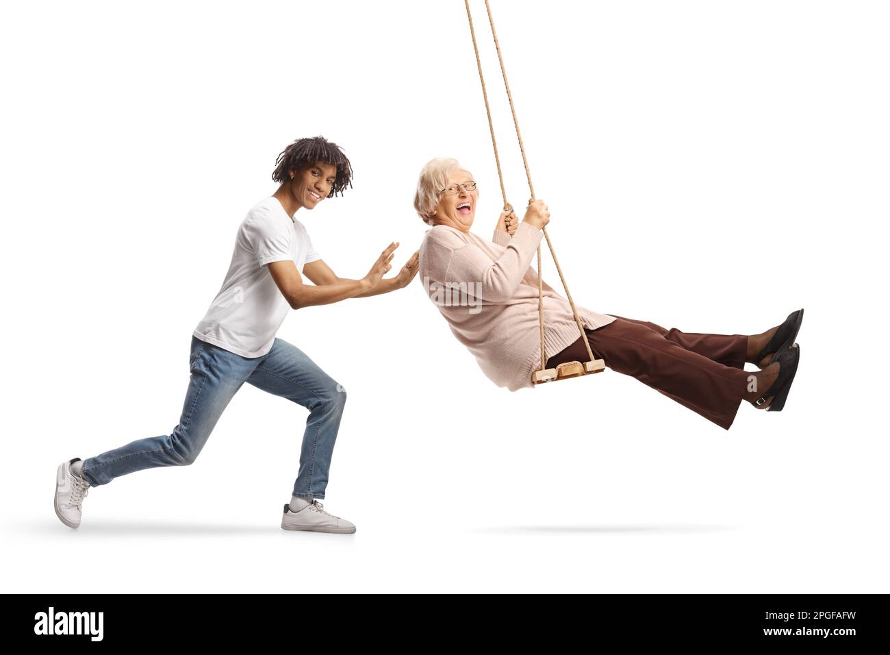 Young african american man pushing a caucasian senior woman on a swing ...