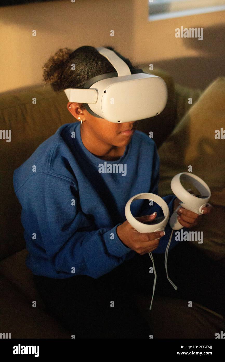 teenager playing virtual reality game Stock Photo - Alamy