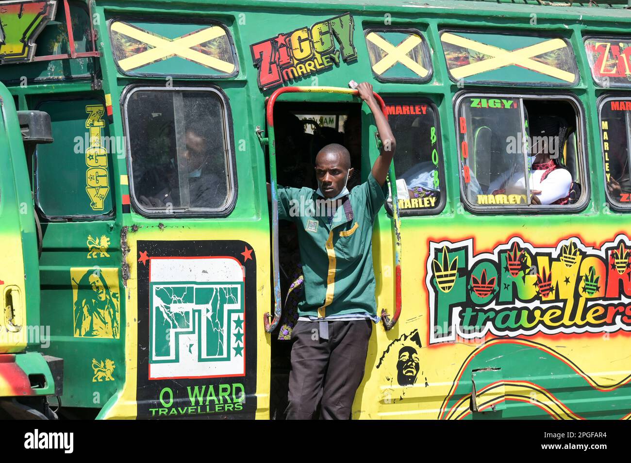 KENYA, Nairobi, Graffiti street art and traffic, colorful painted SACCO ...