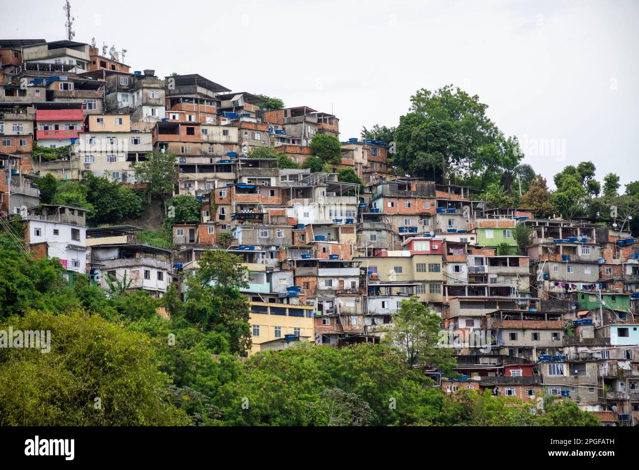 Beautiful view to poor favela houses on hill side Stock Photo - Alamy