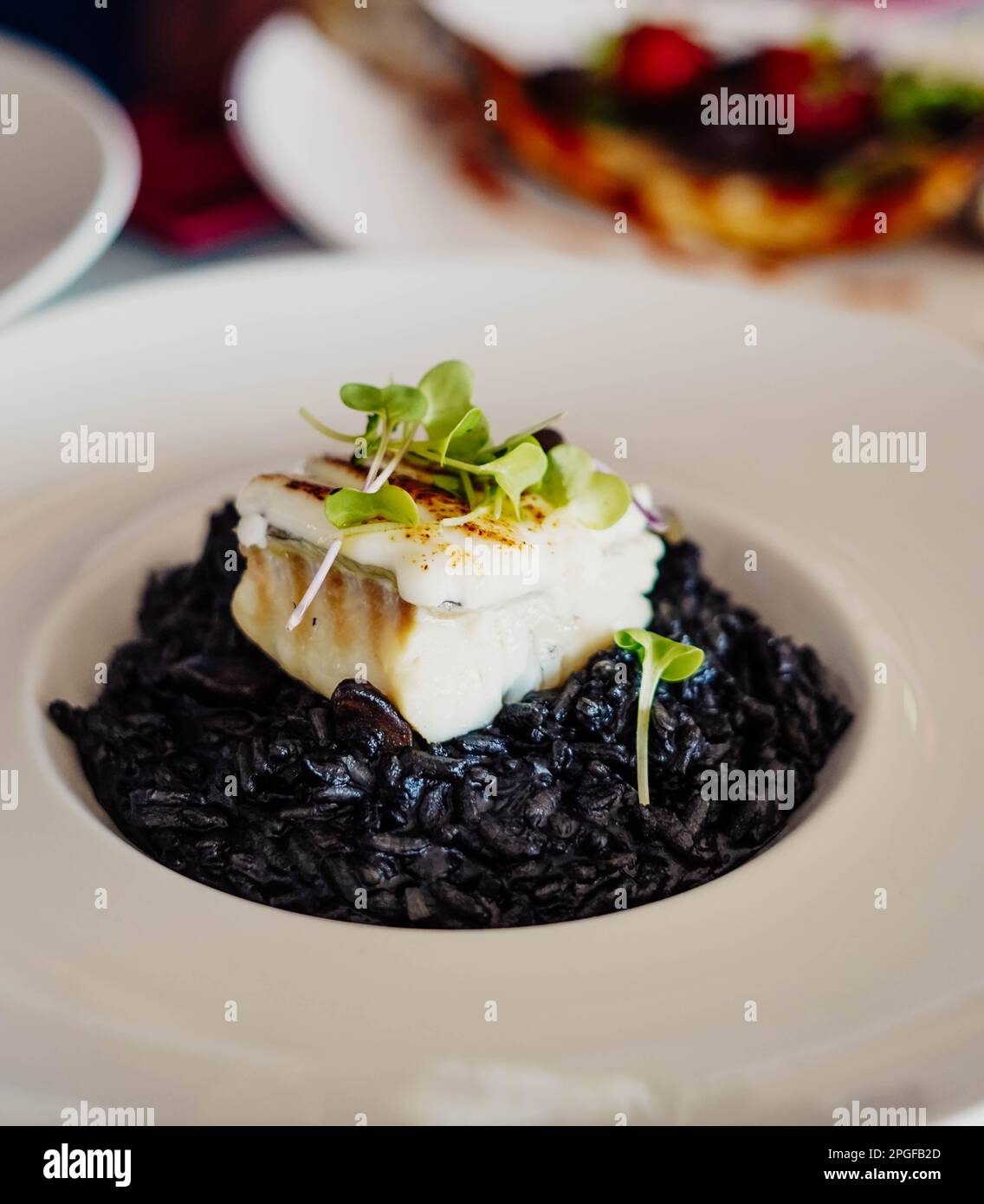 Black rice with cuttlefish and squid ink Stock Photo - Alamy