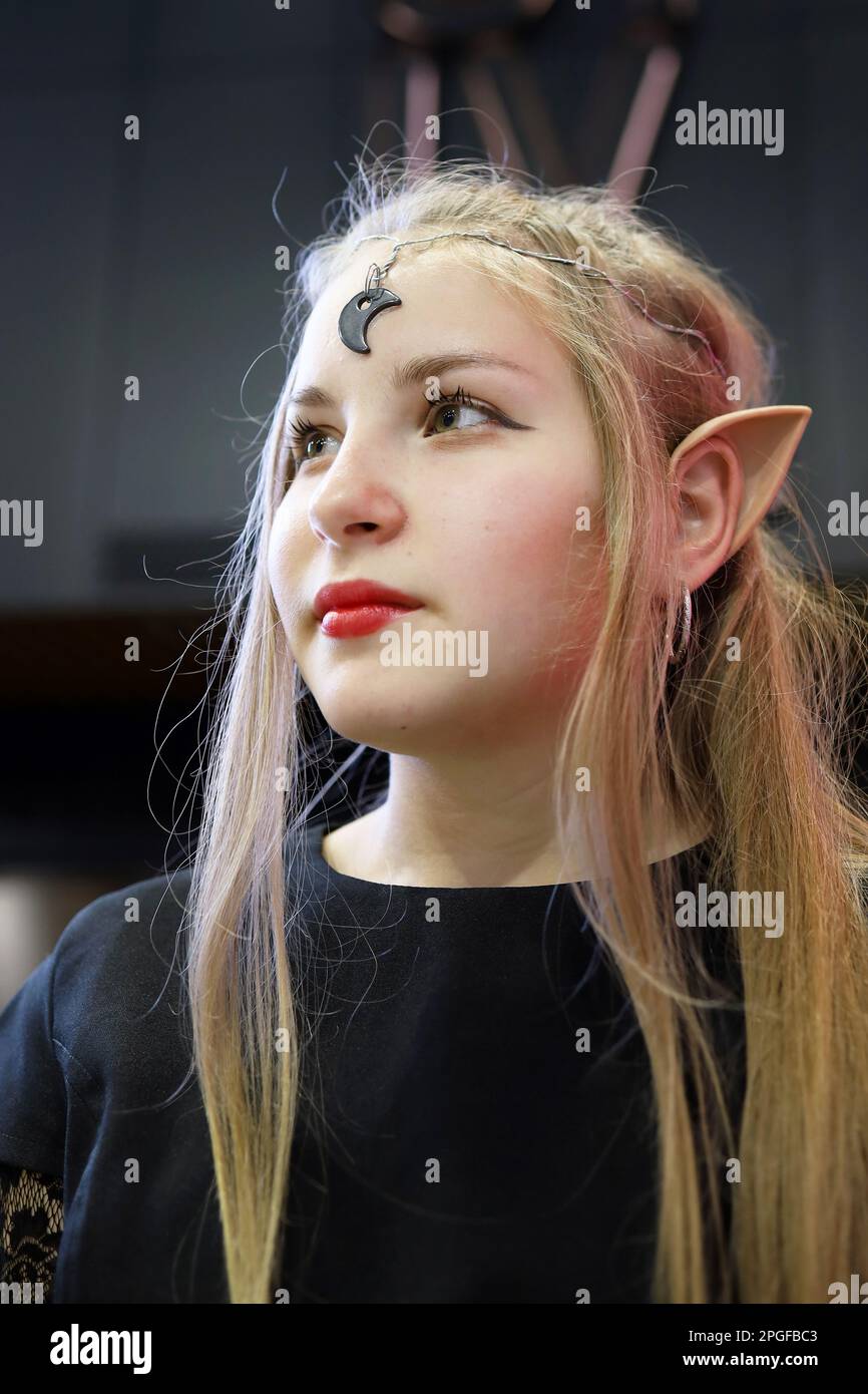 A teenage girl in the image of an elf at a movie night party Stock ...