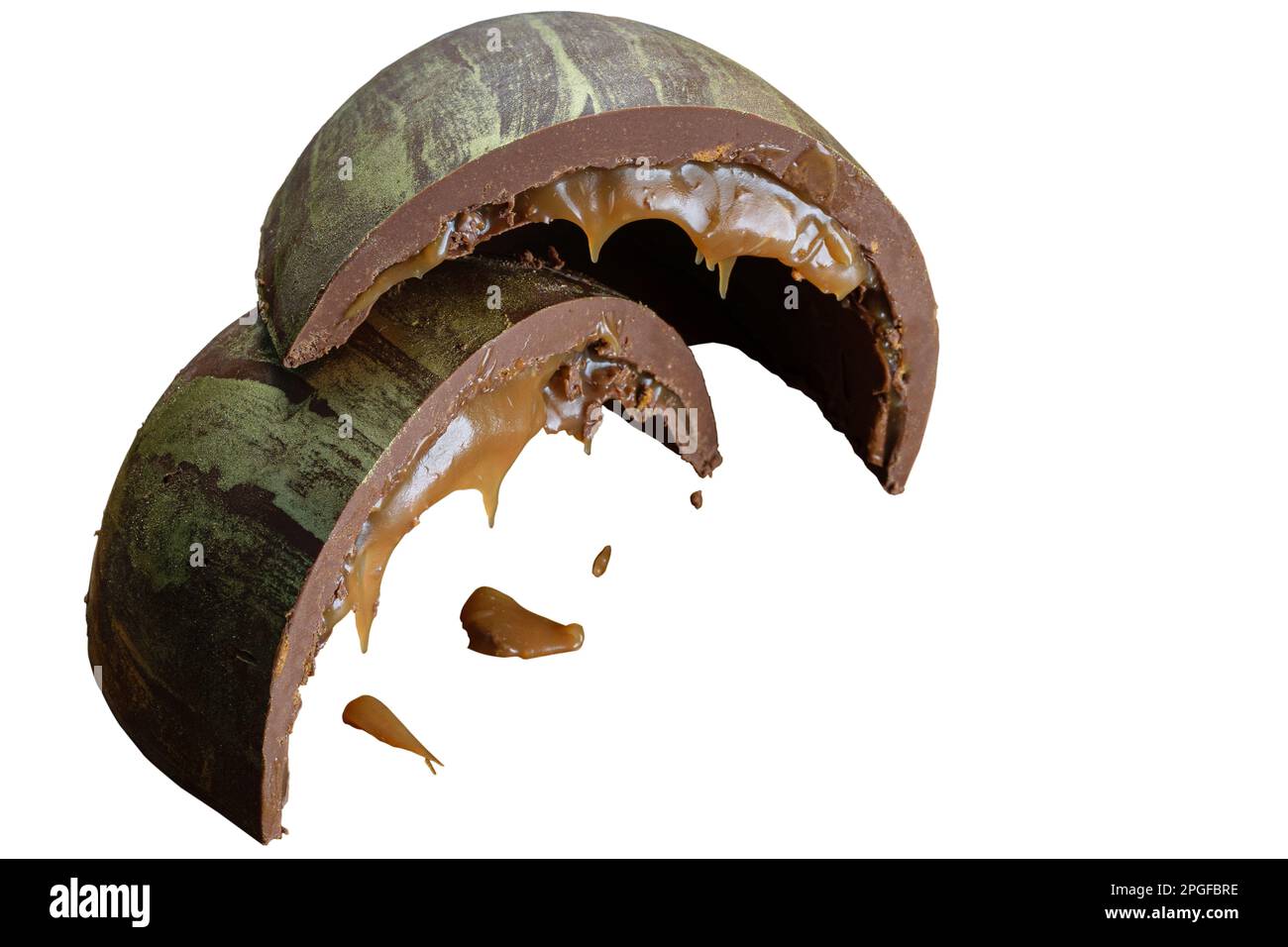 Half a sliced Easter egg with double shell stuffed with melted caramel ...