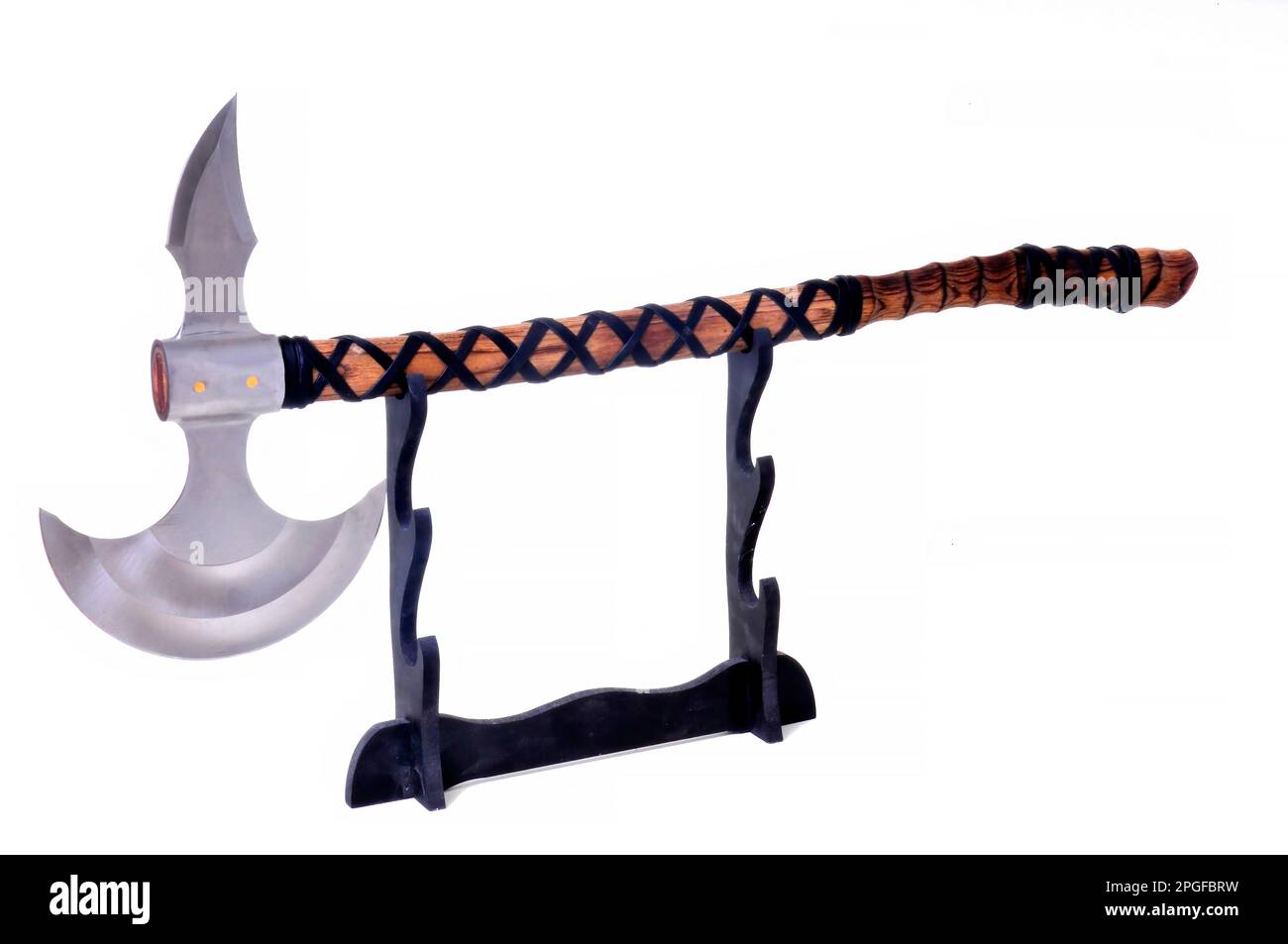 Double blade battle axe Isolated over white resting on a display rack ...