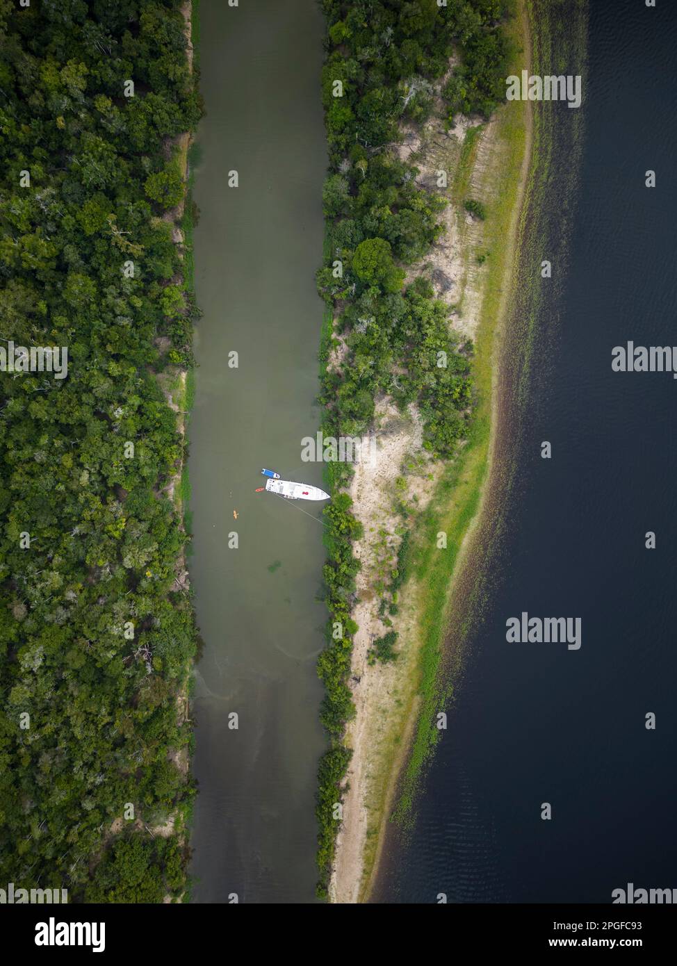 Beautiful top down drone view to large rivers and white tour boat Stock ...