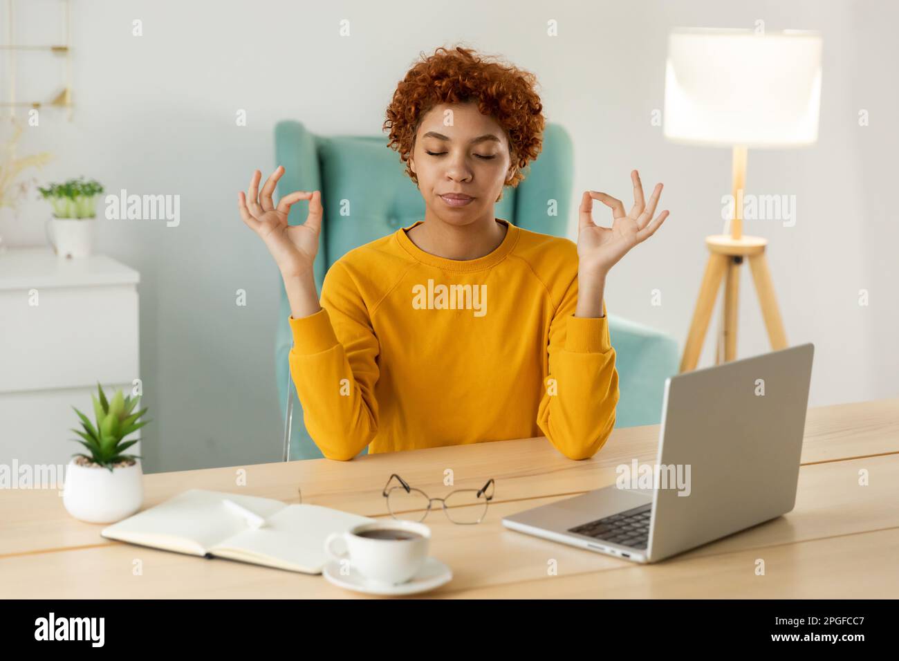 No stress keep calm. Mindful african businesswoman practices breathing ...