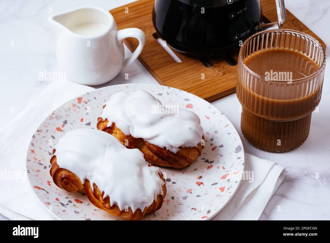 homemade eclairs with white vanilla glaze Stock Photo - Alamy