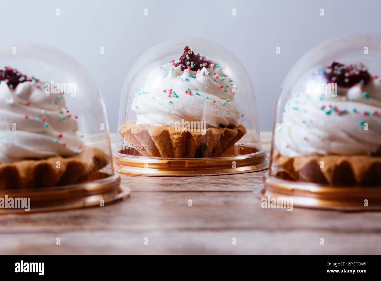 homemade cupcake with a cap of buttercream and jam Stock Photo - Alamy
