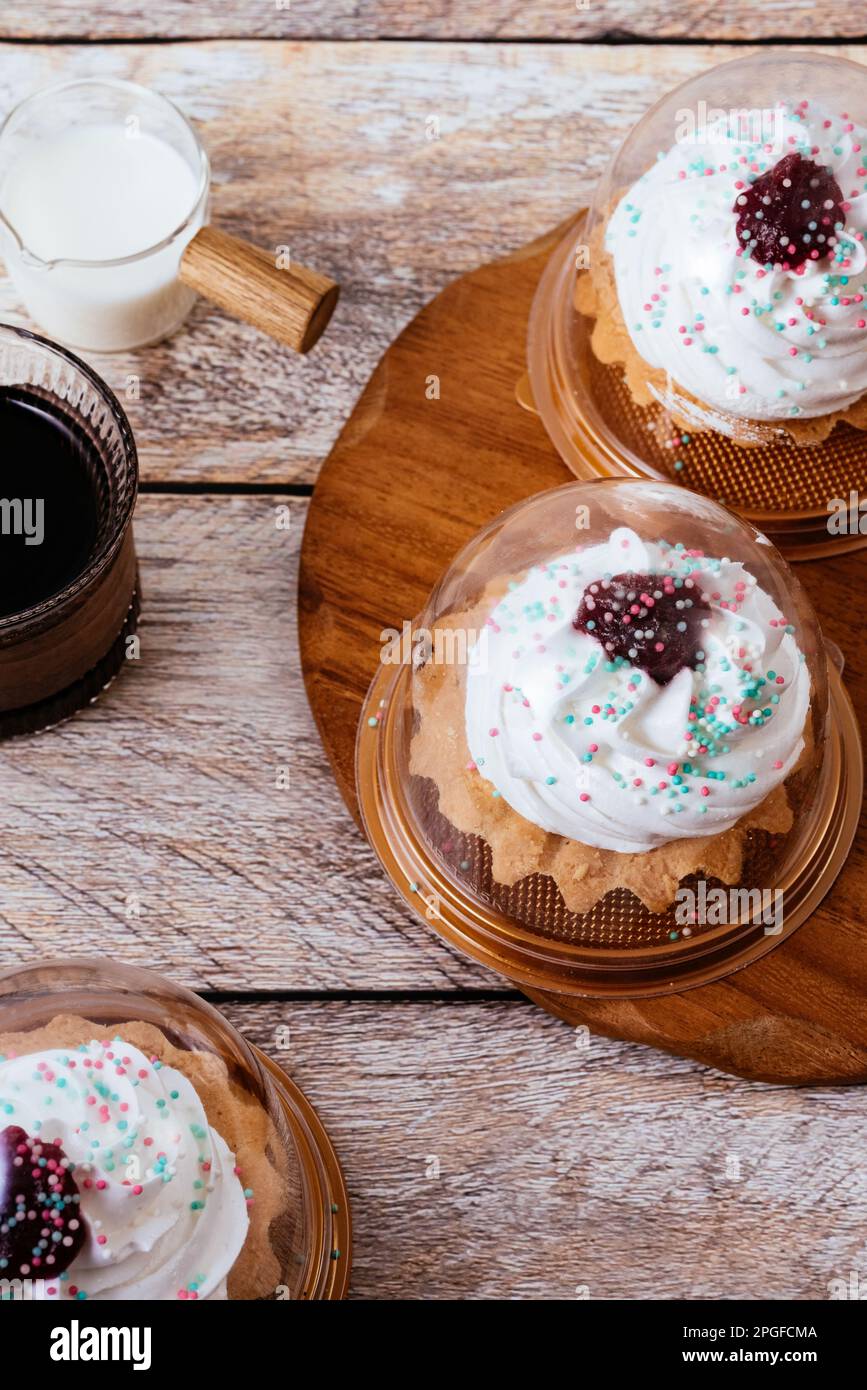 homemade cupcake with a cap of buttercream and jam Stock Photo - Alamy