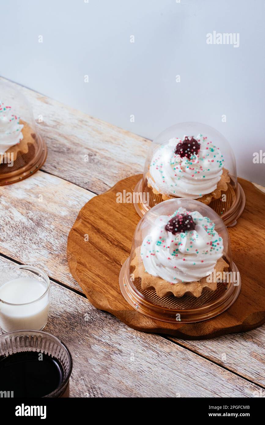 homemade cupcake with a cap of buttercream and jam Stock Photo - Alamy