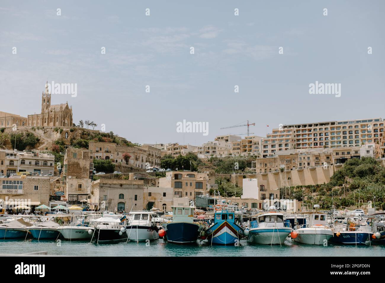 View of the ancient architecture and sail boats in Gozo Island, Malta ...