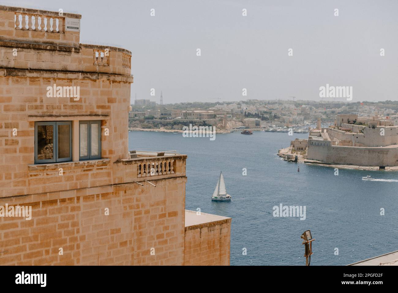 View of the sea and a sail boat from a lookout in Valletta Stock Photo ...