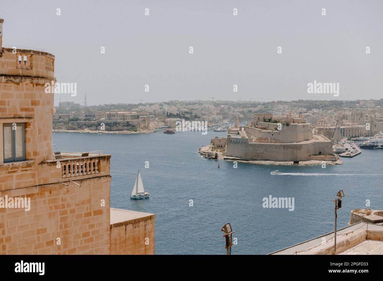 View of the sea and a sail boat from a lookout in Valletta Stock Photo ...