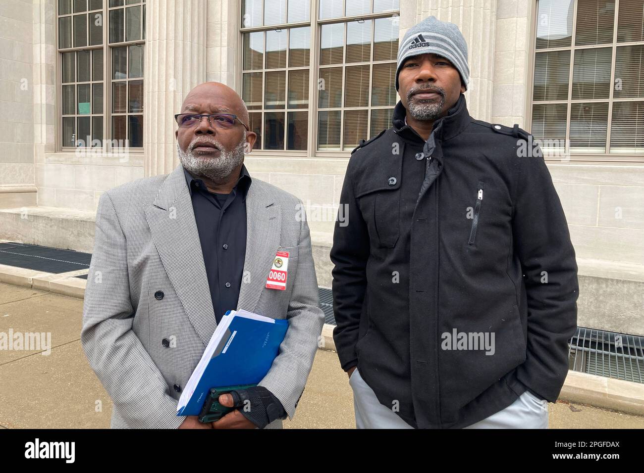 FILE - Willie Earvin Jr., left and Larry Pippion stand after testifying ...