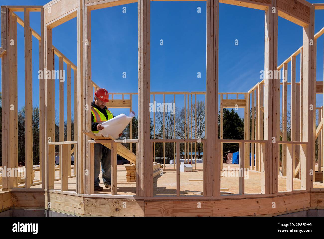 Architect checks building blueprints on hi-res stock photography and ...
