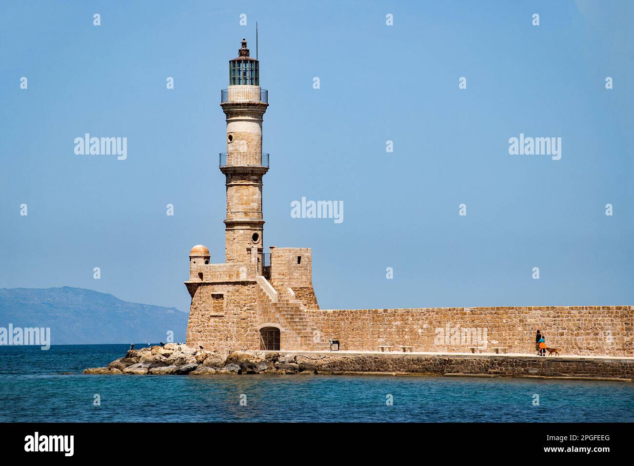 The lighthouse tower on the harbour wall at Chania, in Crete, Greece ...