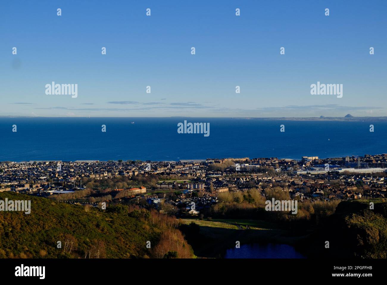 A stunning aerial view of a vibrant coastal town with an array of ...