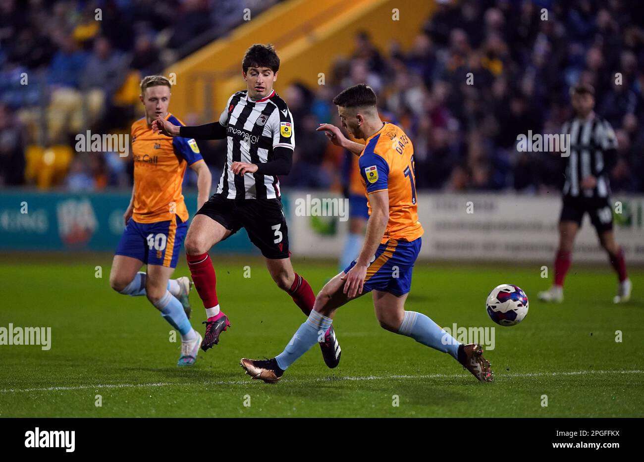 Mansfield Town’s Rhys Oates and Grimsby Town’s Anthony Driscoll-Glennon ...