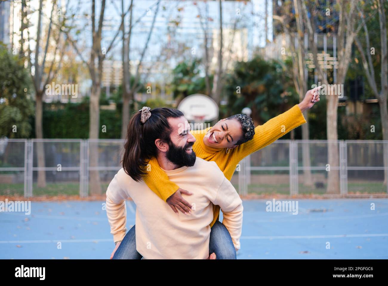 Two young people spending a fun afternoon outdoors and with very happy ...