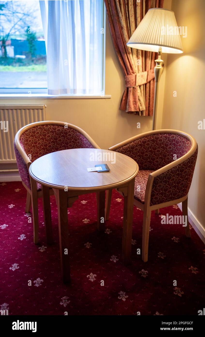 Hotel room chairs and table. empty Stock Photo - Alamy