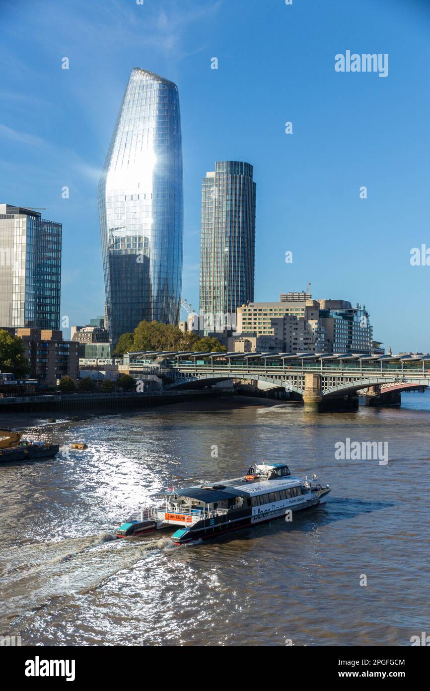 One Blackfriars and Southbank Tower with passenger ferry passing along ...
