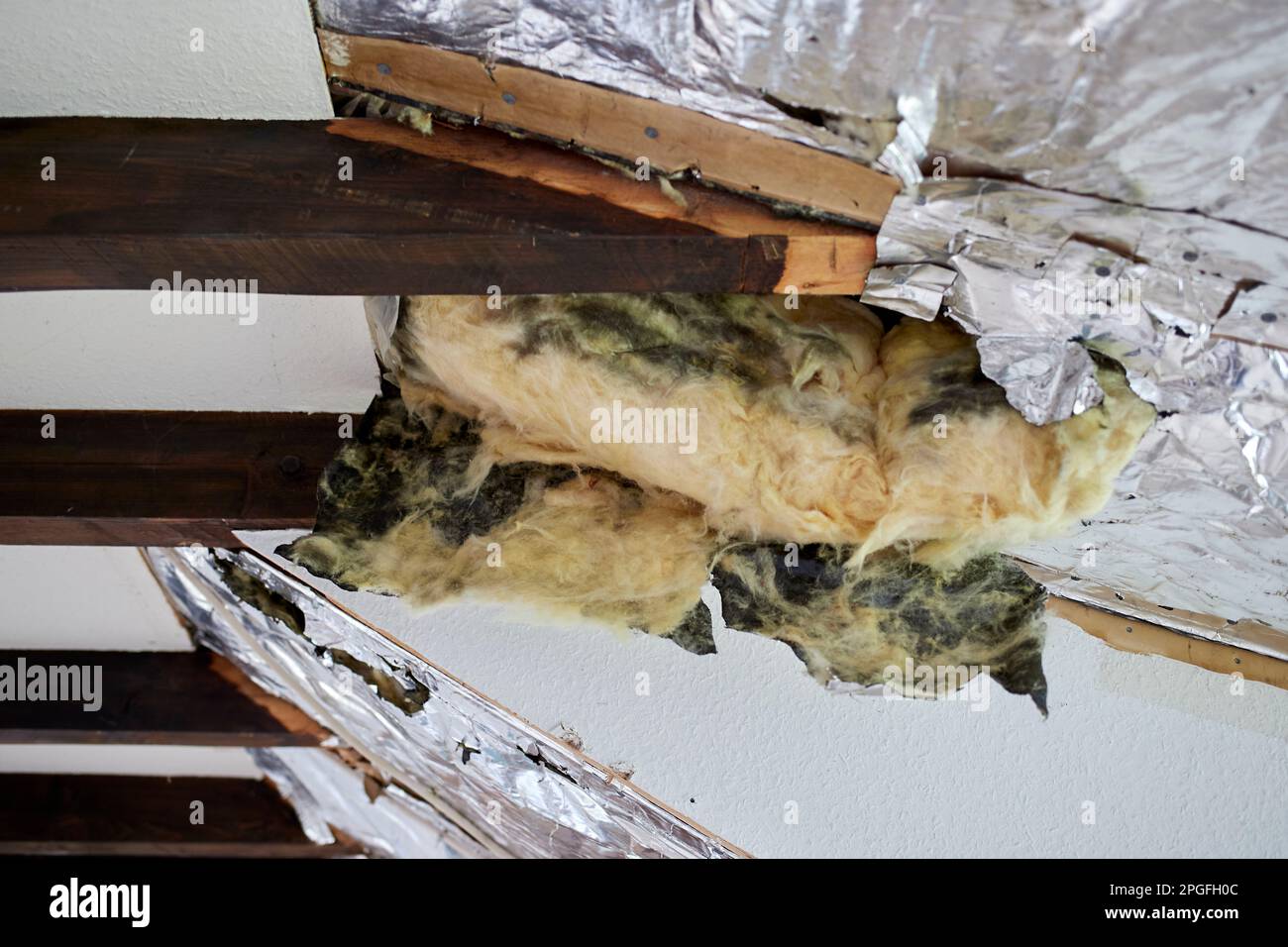 exposed old roof insulation in a house Stock Photo - Alamy