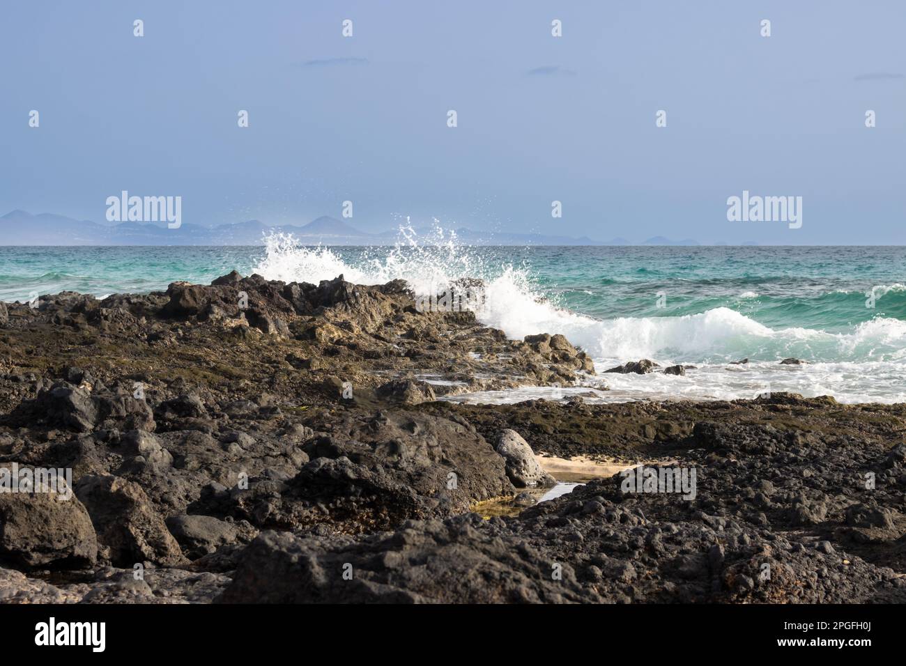 Rocky shore of the coastline, where the unique european desert meets ...