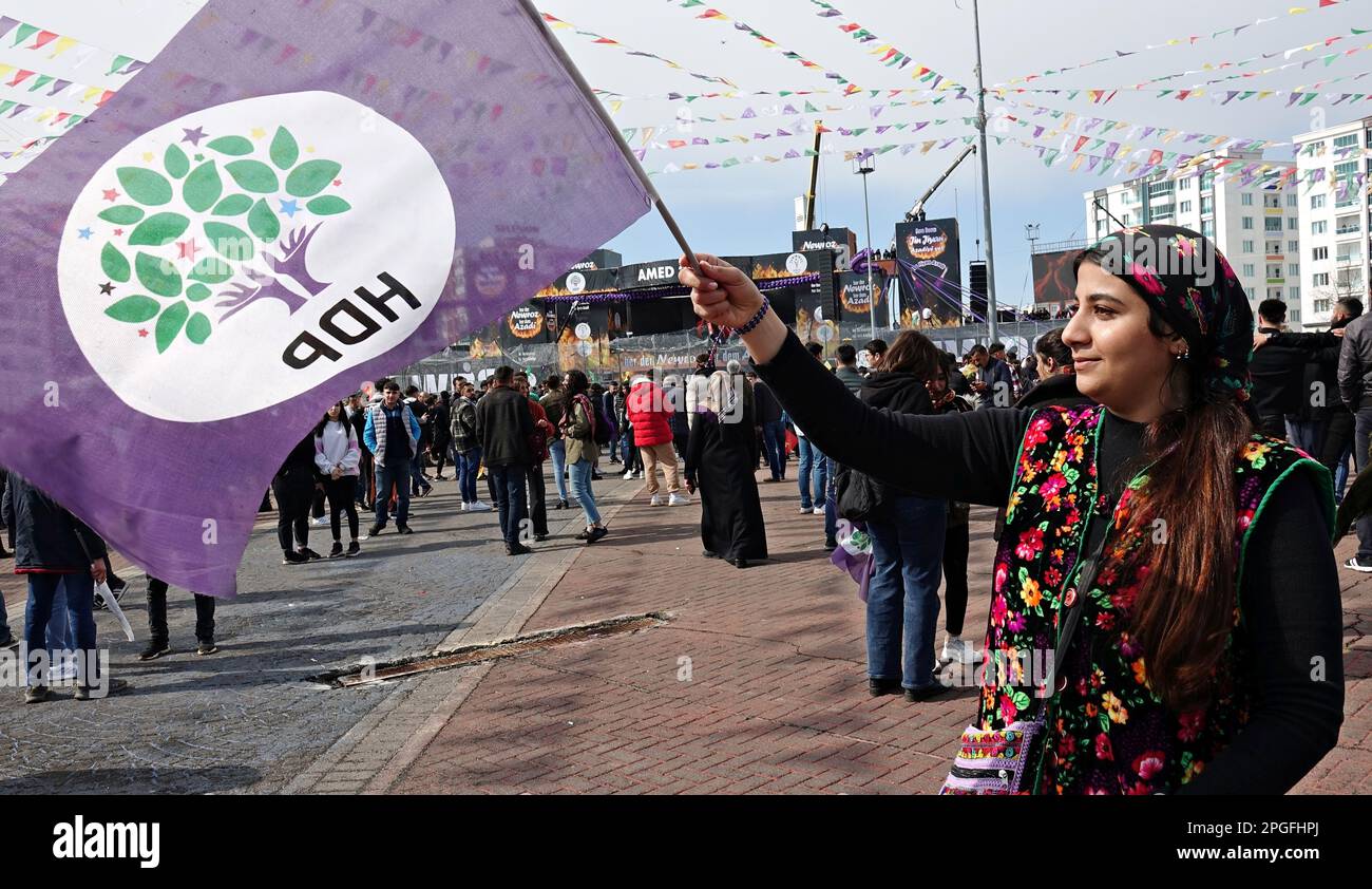 A young Kurdish woman is seen with the HDP flag as she takes part ...