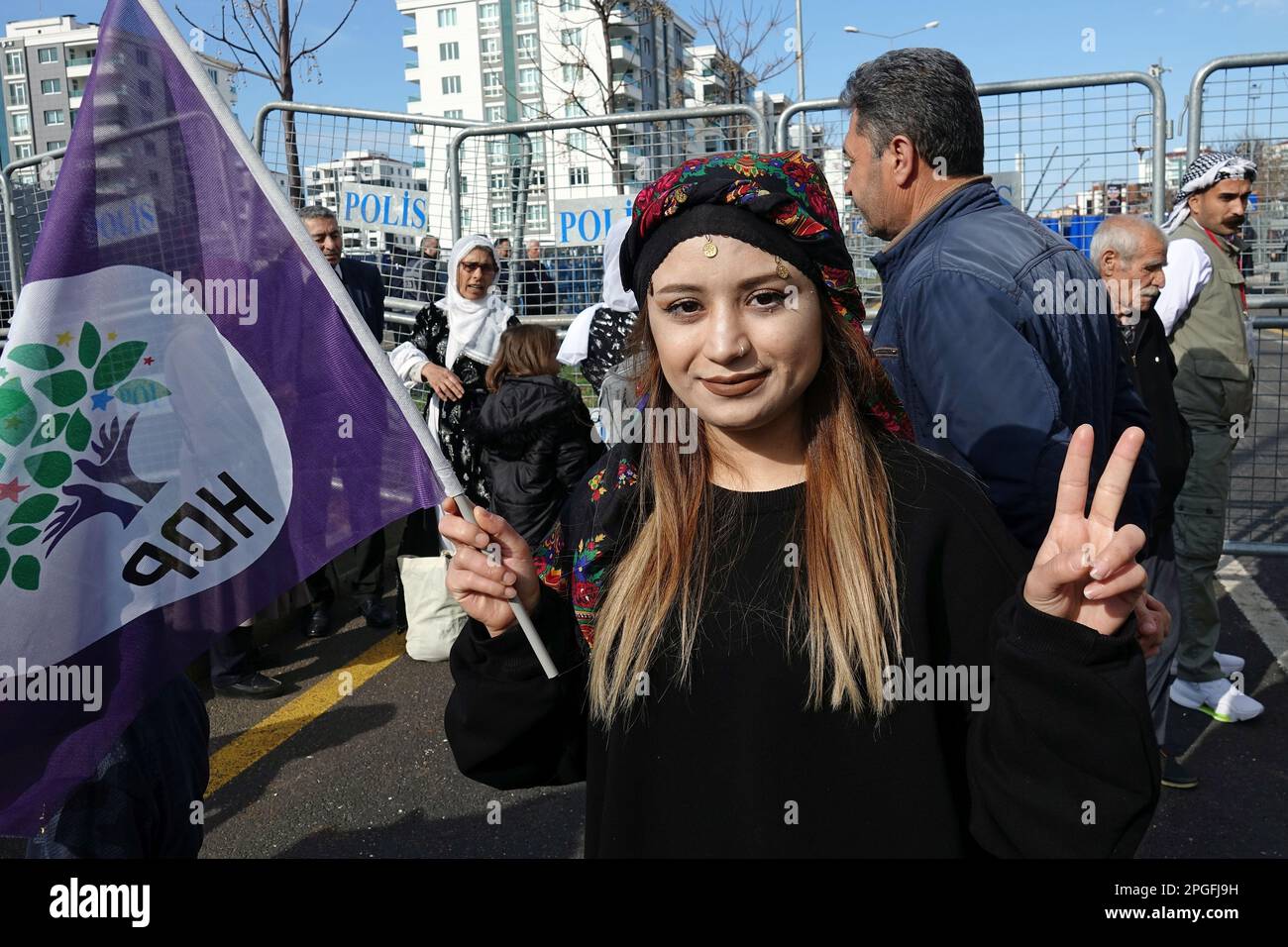 A young Kurdish woman is seen with the HDP flag as she takes part ...