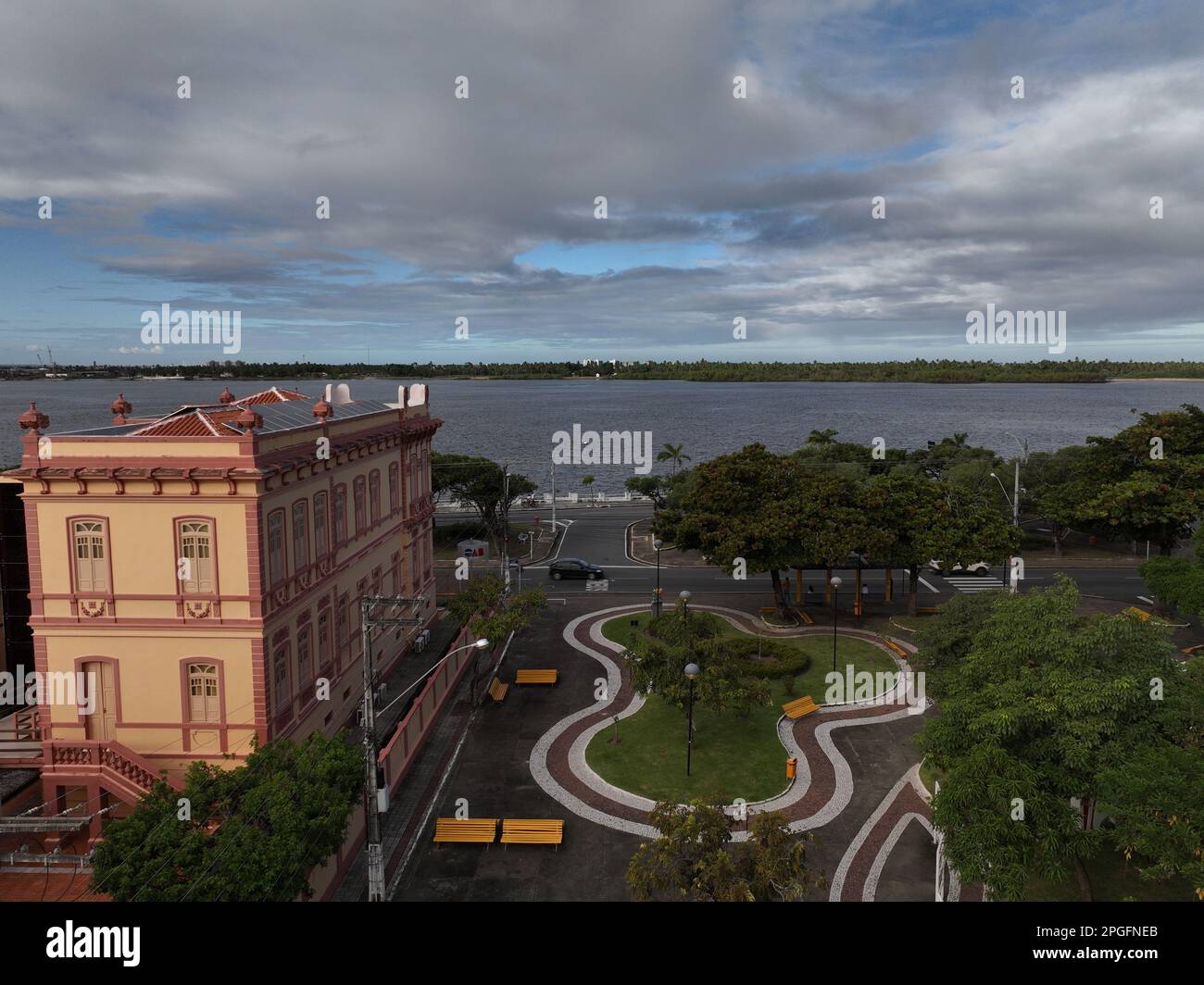 This is an aerial view of a vibrant cityscape featuring a city square ...