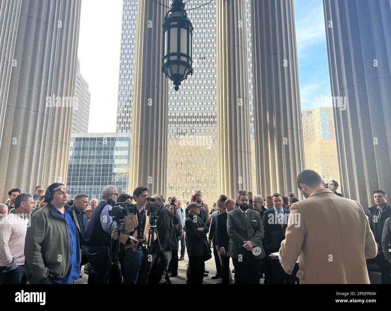 New York, USA. 22nd Mar, 2023. Auctioneer Matthew D. Mannion (r), in ...