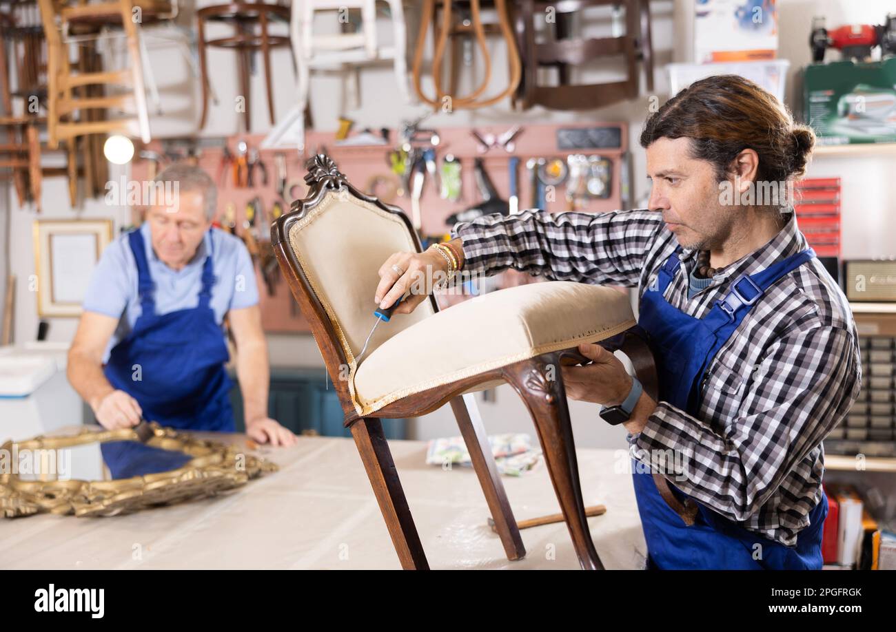 Professional furniture male restorer hi-res stock photography and ...
