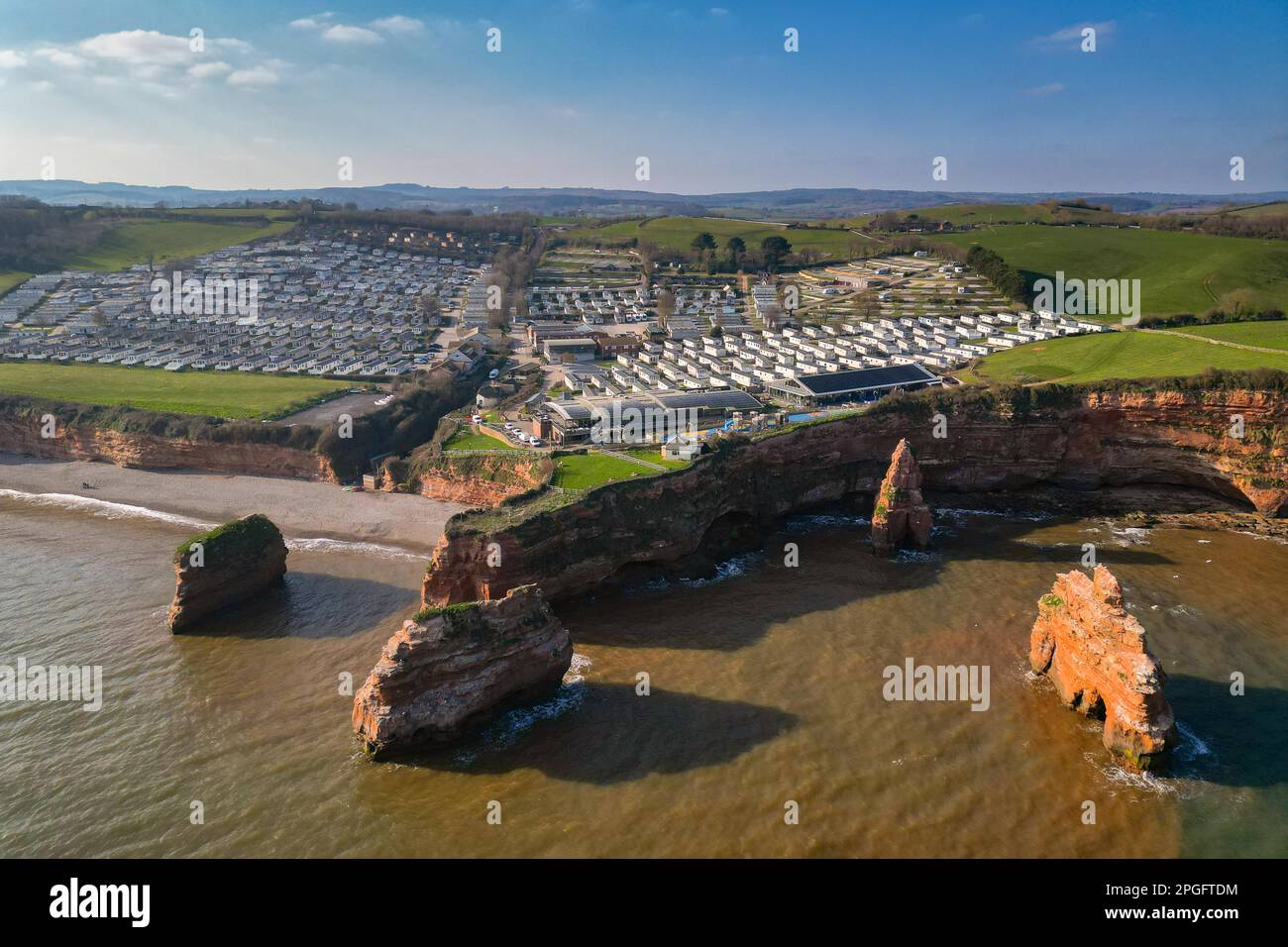 Aerial view of the sandstone rock pinnacles and cliffs at Ladram Bay ...