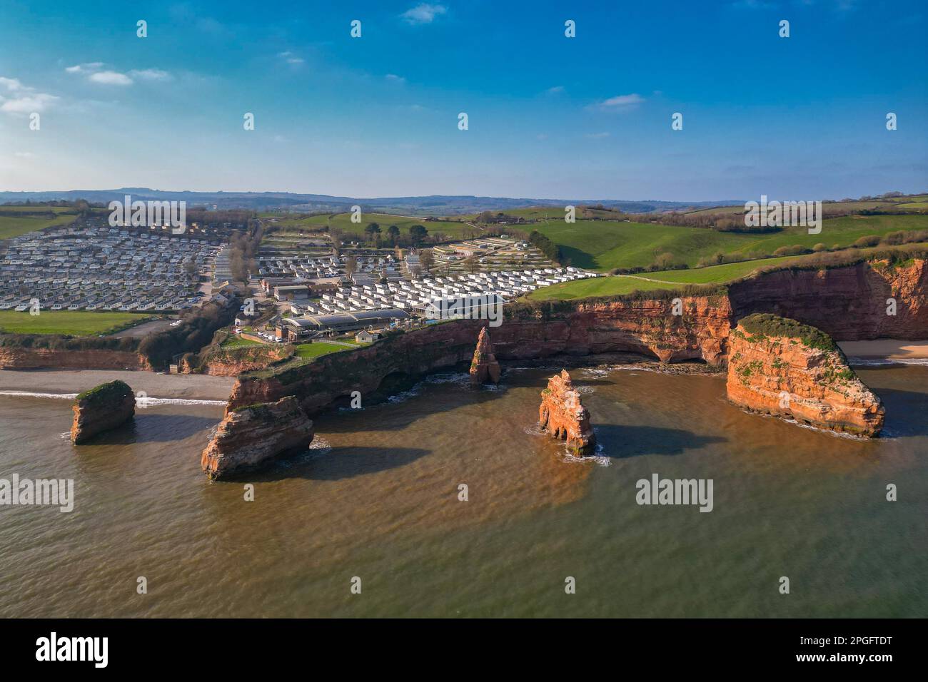 Aerial view of the sandstone rock pinnacles and cliffs at Ladram Bay ...