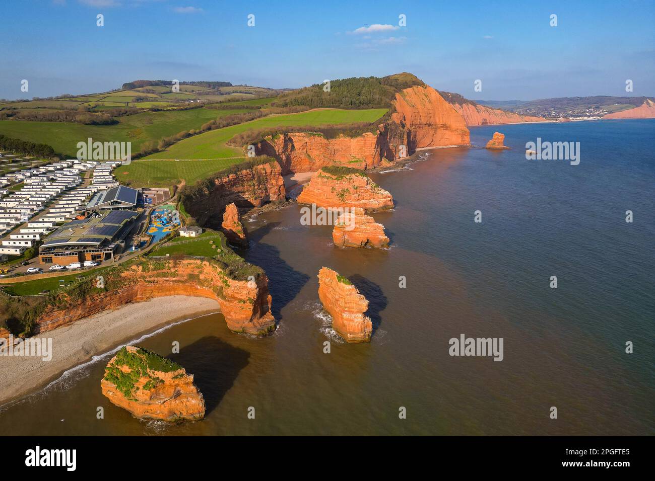 Aerial view of the sandstone rock pinnacles and cliffs at Ladram Bay ...