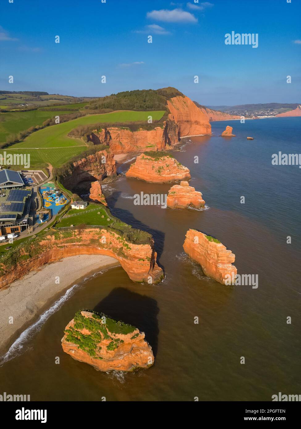 Aerial view of the sandstone rock pinnacles and cliffs at Ladram Bay ...