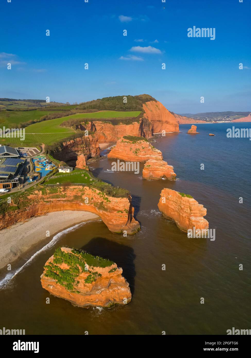 Aerial view of the sandstone rock pinnacles and cliffs at Ladram Bay ...