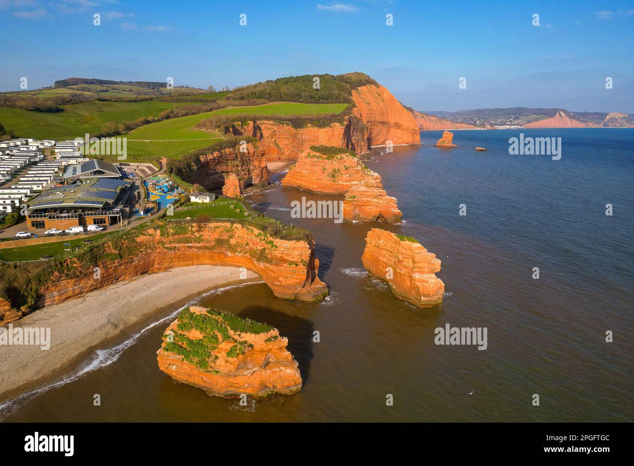 Aerial view of the sandstone rock pinnacles and cliffs at Ladram Bay ...