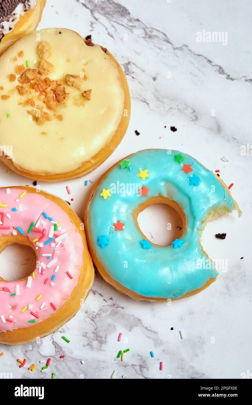 several different donuts on a white background Stock Photo - Alamy