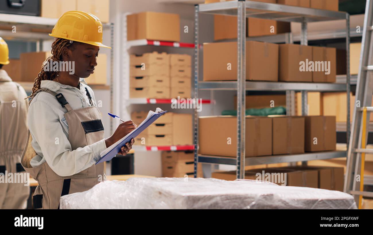 Team of depot workers talking about delivery shipment in storehouse ...