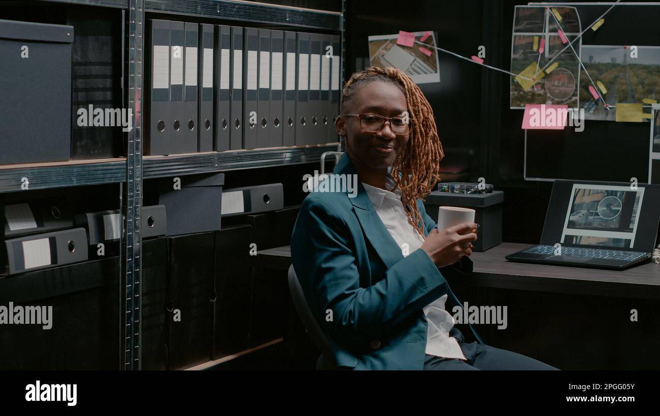 African American Woman Working In Police Archive Space Preparing To