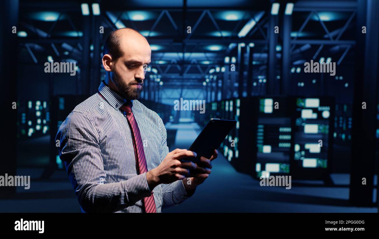 System Administrator Activating Hardware In Data Center With Tablet