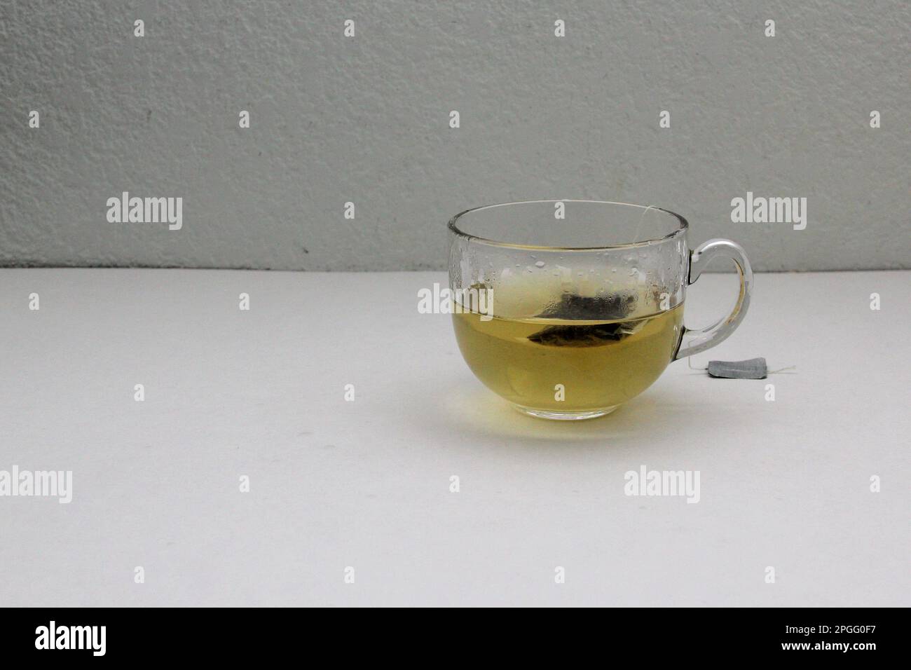 Infusion tools for herbal tea in glass cup, infuser and dried leaves ...