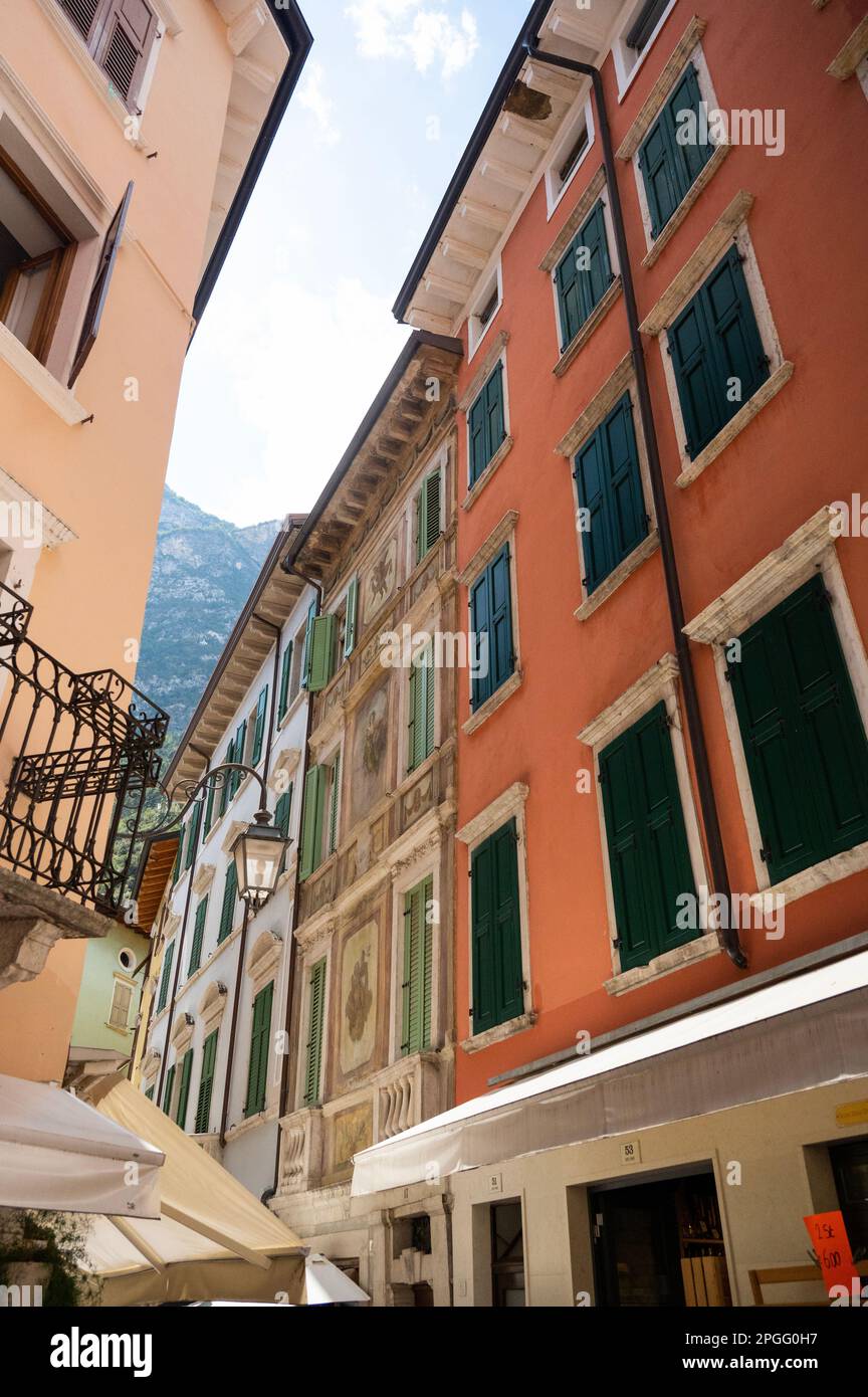 Colourful stucco building and narrow streets of Riva Sul Garda, the old ...