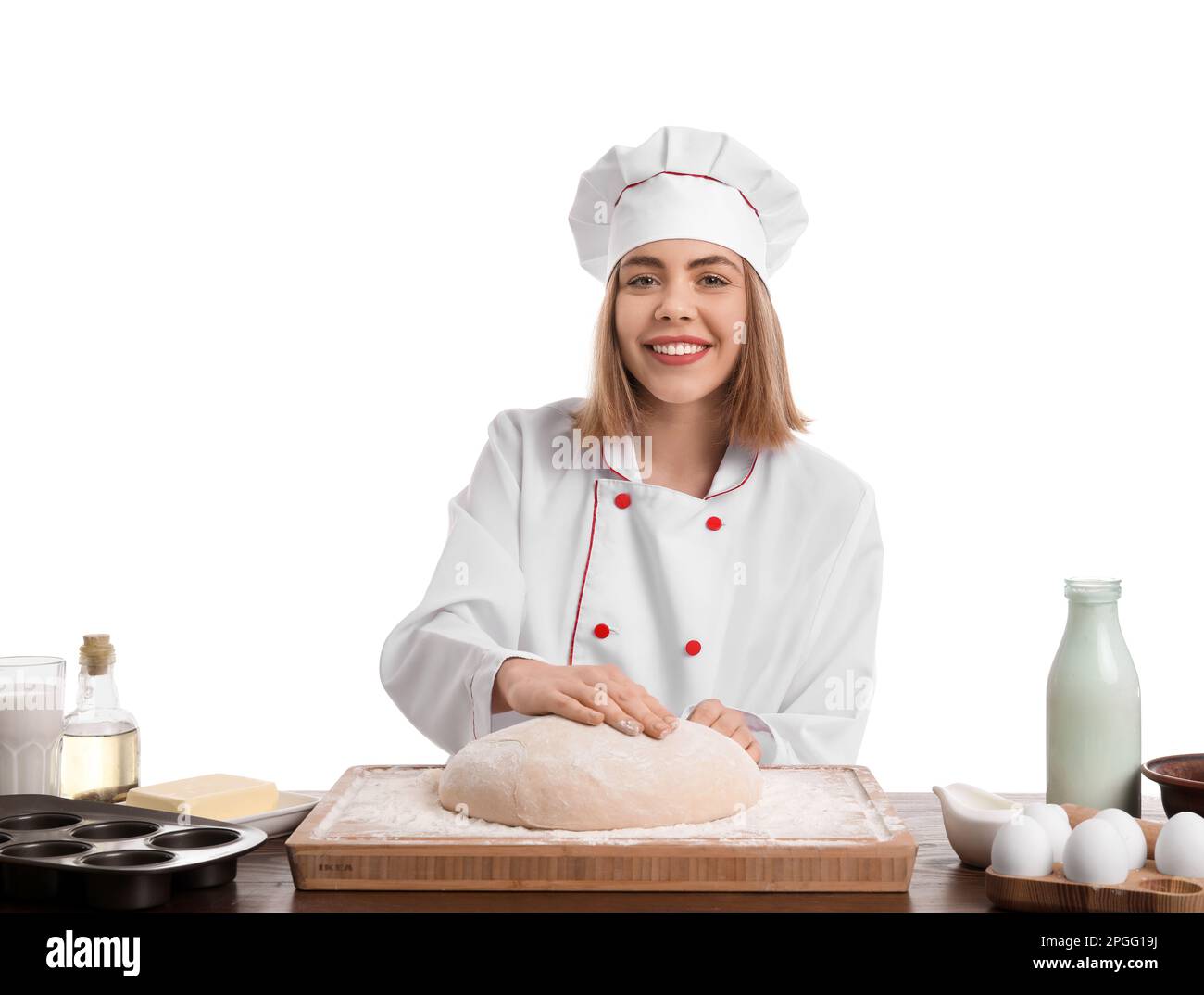 Female baker with raw dough at table on white background Stock Photo ...