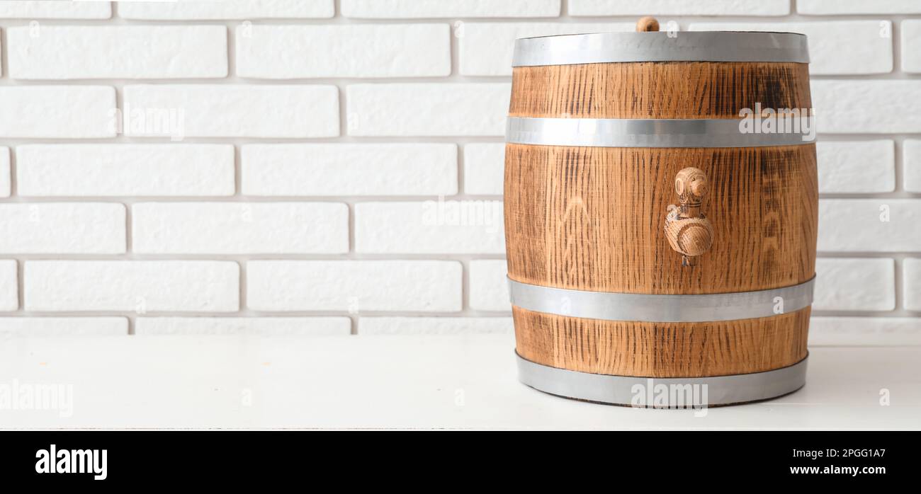 Wooden barrel on white brick background with space for text Stock Photo ...