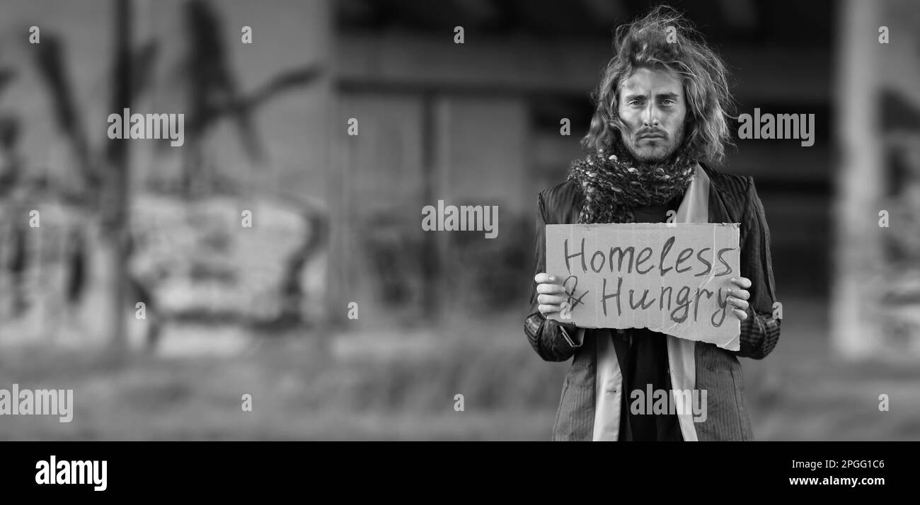 Homeless person with cardboard Black and White Stock Photos & Images ...