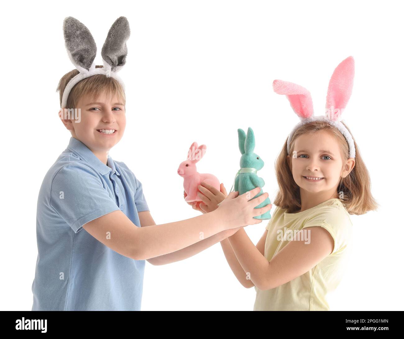 Little children in bunny ears with Easter rabbits on white background ...